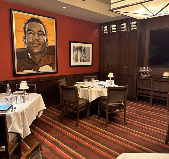 Rich wood, deep reds, and portraits watching over diners. Like dining in a private club where the secret password is "medium rare."