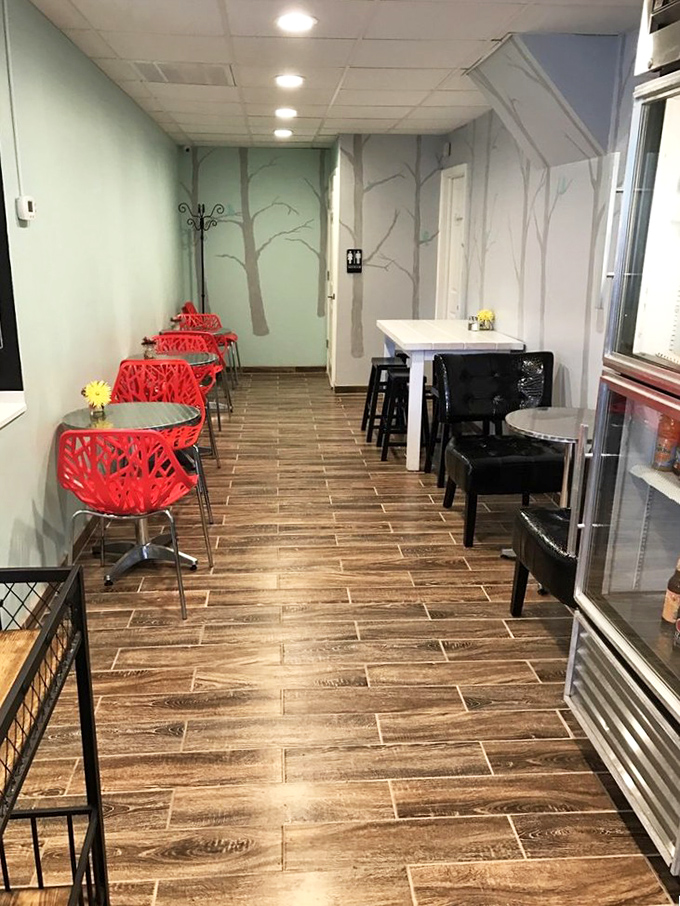 The dining area whispers, "Stay awhile." Minimalist design with pops of red creates the perfect backdrop for serious pie contemplation.