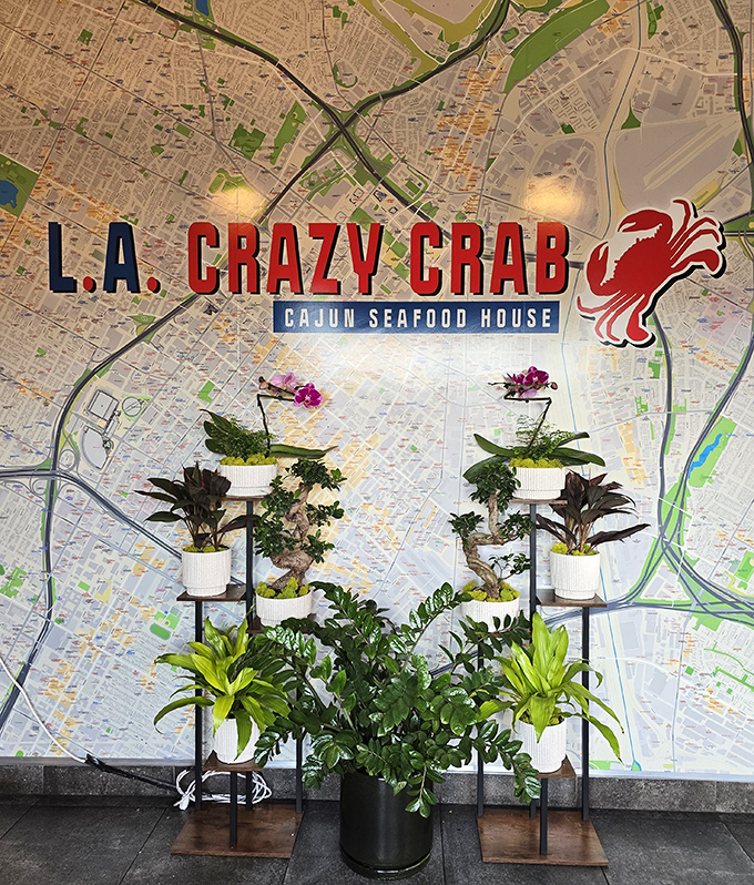 A Los Angeles map mural adorned with plants creates an Instagram-worthy backdrop for your pre-seafood selfies.