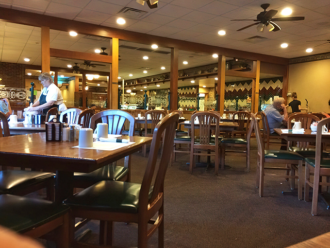Mirrors multiply the warmth of this dining room, reflecting decades of conversations, celebrations, and "I shouldn't, but I will" dessert decisions.