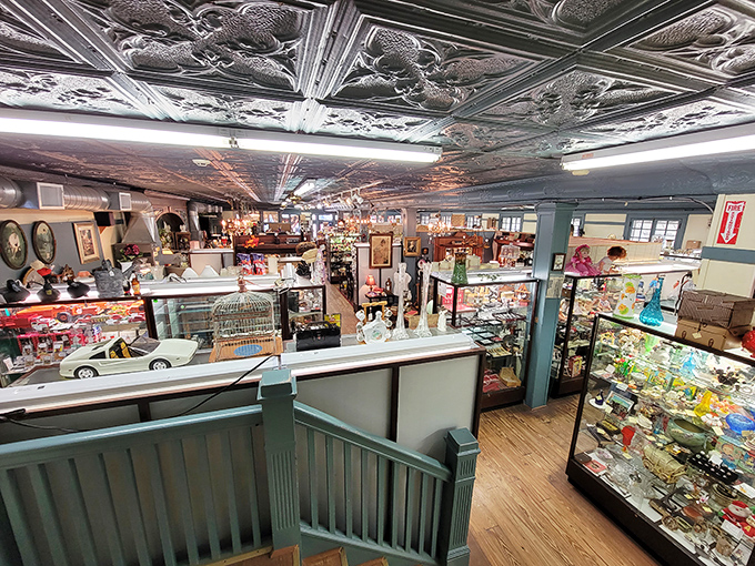 The view from above reveals the true scale of this treasure trove, with its ornate tin ceiling and carefully arranged display cases.