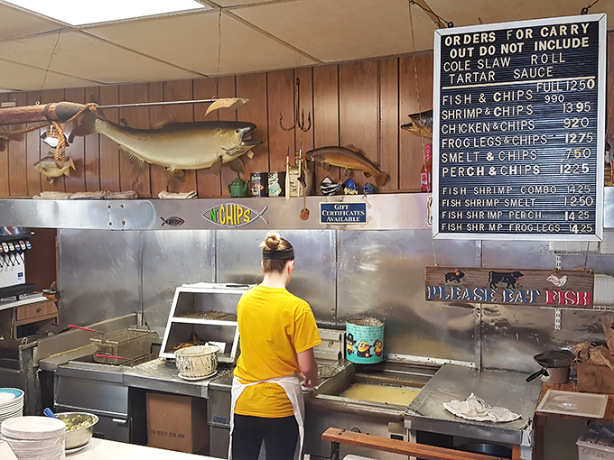 The kitchen view reveals the beating heart of Scotty's operation&mdash;where fresh fish meets hot oil in a dance as old as Detroit itself.