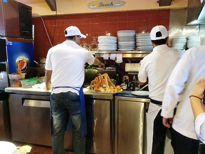 Behind the scenes, kitchen magicians transform the morning's catch into the afternoon's happiness. Those crab legs are about to make someone's day.