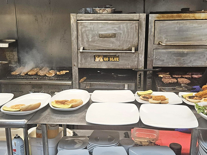 Behind the scenes, the magic happens&mdash;meats sizzle on the grill while plates await their delicious destiny.