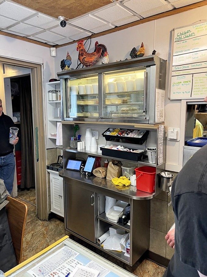 Behind the scenes, where chicken magic happens &ndash; note the rooster decorations watching over their delicious descendants.