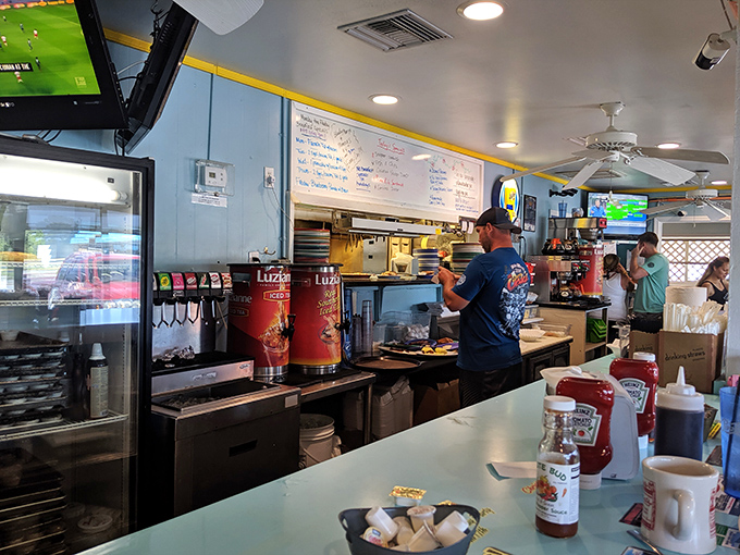 Behind the scenes, where seafood transforms from ocean treasure to plate perfection. The kitchen's rhythm is as steady as the tides.