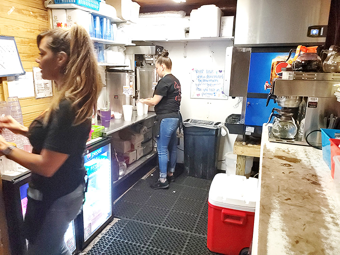 The kitchen where the magic happens—no smoke and mirrors, just smoke and skill turning simple ingredients into something transcendent.