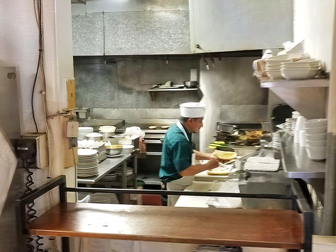 A glimpse into the kitchen reveals the choreography of short-order cooking&mdash;where breakfast magic happens without pretense or fanfare.