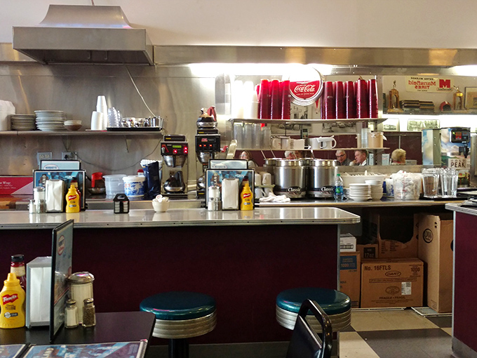 Behind the scenes where the magic happens. Stainless steel, organized chaos, and decades of cooking wisdom combine to create diner perfection.