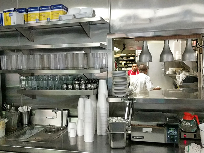 The kitchen&mdash;where morning magic happens with military efficiency. These aren't just cooks; they're breakfast commandos executing perfect egg missions.