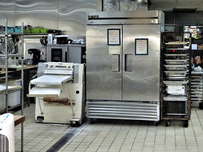 The kitchen's gleaming equipment stands ready for another day of dough-rolling, bread-baking magic that transforms flour into art.