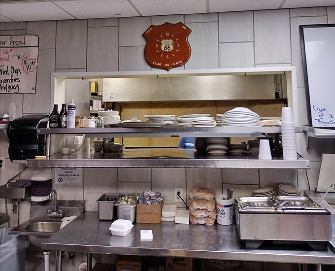 Behind the scenes where the magic happens. That Route 66 shield watches over the kitchen like a guardian angel of good taste.