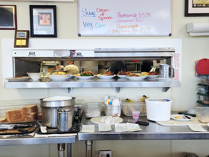 The open kitchen reveals the breakfast ballet in action, where skilled cooks orchestrate morning miracles with practiced precision.