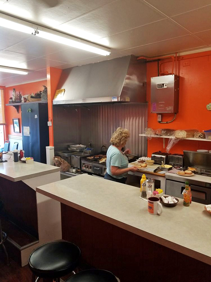 Behind the scenes, skilled hands work their magic on griddles that have perfected the art of morning happiness.