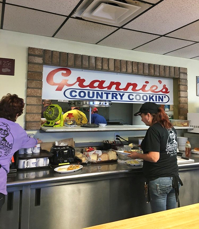 Where breakfast magic happens – the pass-through window offering glimpses of the choreographed chaos that produces plate after perfect plate.