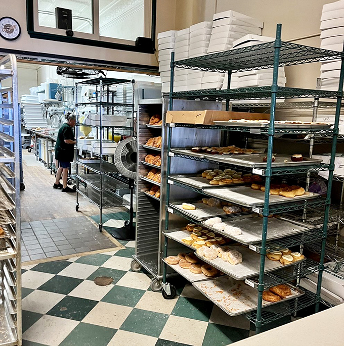 Behind the scenes where donut magic happens. Those racks aren't just holding pastries&mdash;they're cradling dreams.