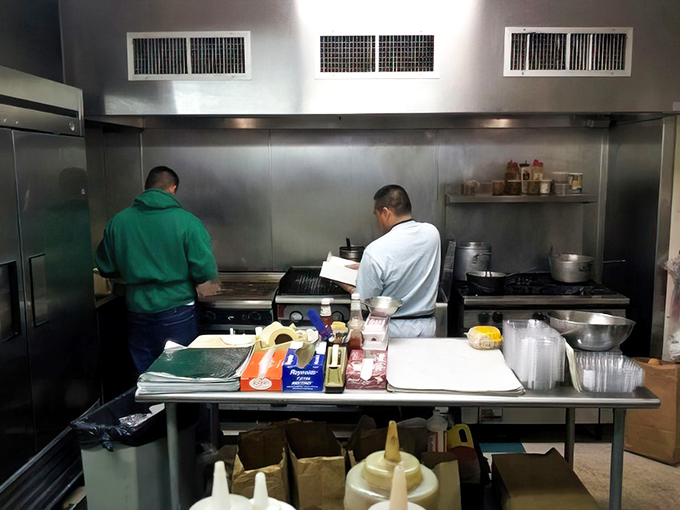 Where the magic happens. The kitchen's well-seasoned grill has seen thousands of cheesesteaks come to life under skilled hands and watchful eyes.
