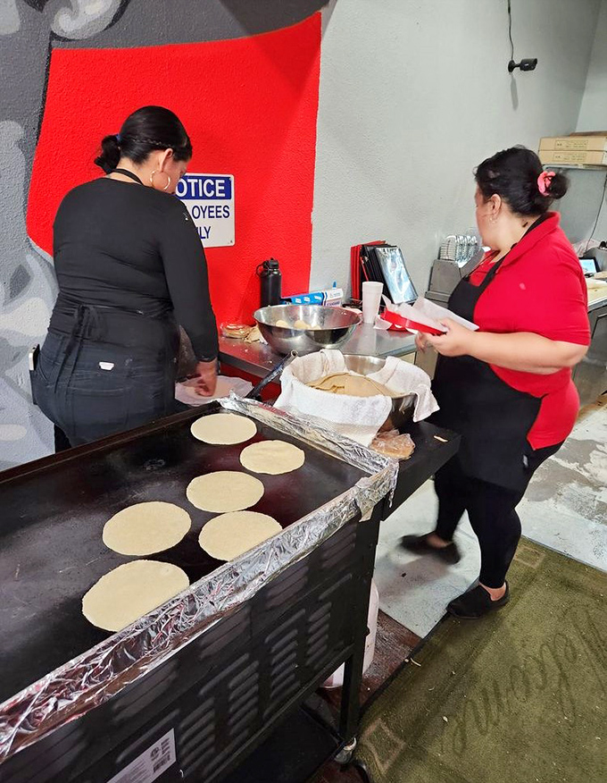 Handmade tortillas in real time—the assembly line of joy that explains why store-bought versions can never compete with this pillowy perfection.