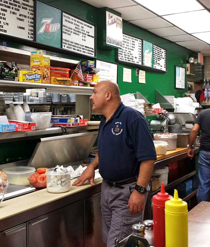 The maestro at work, orchestrating your lunch with the precision of a Swiss watchmaker.