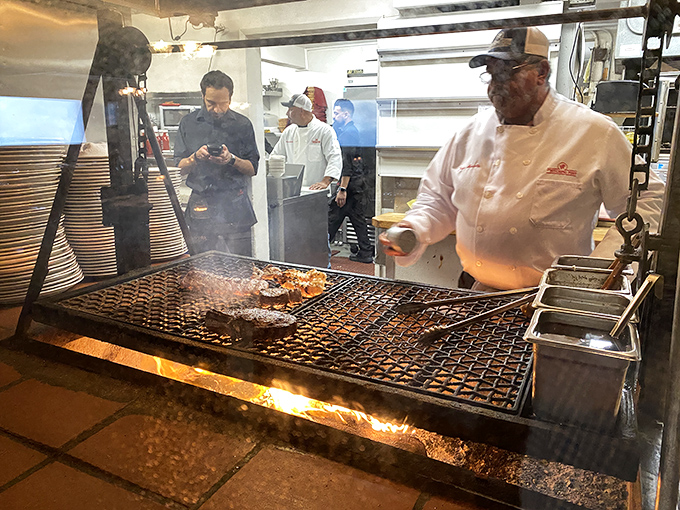 The magic happens here &ndash; where fire meets meat in the ancient dance of Santa Maria-style barbecue. The chef's focused expression says everything about their dedication.