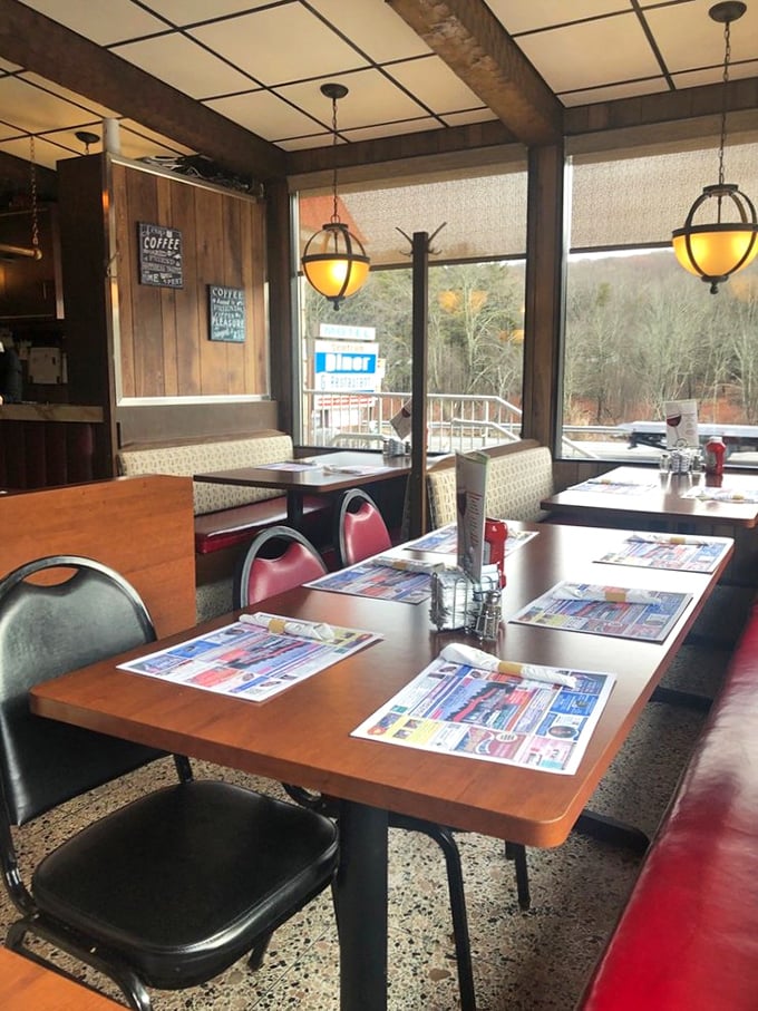 Sunlight streams through windows framing the Pocono landscape, turning an ordinary meal into dinner and a show courtesy of Mother Nature.