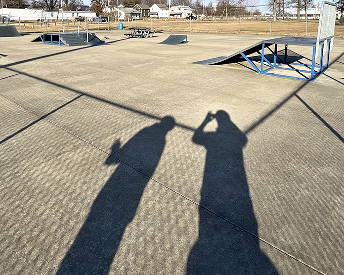 Even shadows can't resist having fun at the skatepark, where concrete dreams await those brave enough to defy gravity on wheels. 