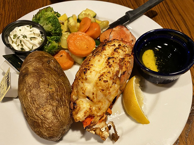 A perfectly broiled lobster tail escorted by seasonal vegetables and a baked potato&mdash;the seafood equivalent of rolling out the red carpet.