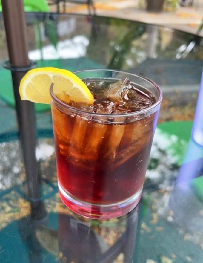 A perfectly balanced Long Island Iced Tea with a lemon wedge &ndash; because sometimes plant-based eating deserves a little liquid celebration.