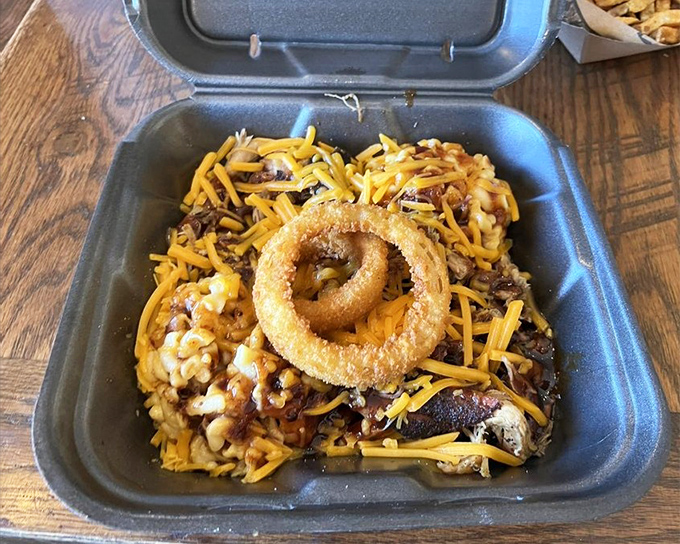 The aptly named "Mess Plate" turns chaos into culinary art, where mac and cheese becomes a bed for meat and that onion ring is king.