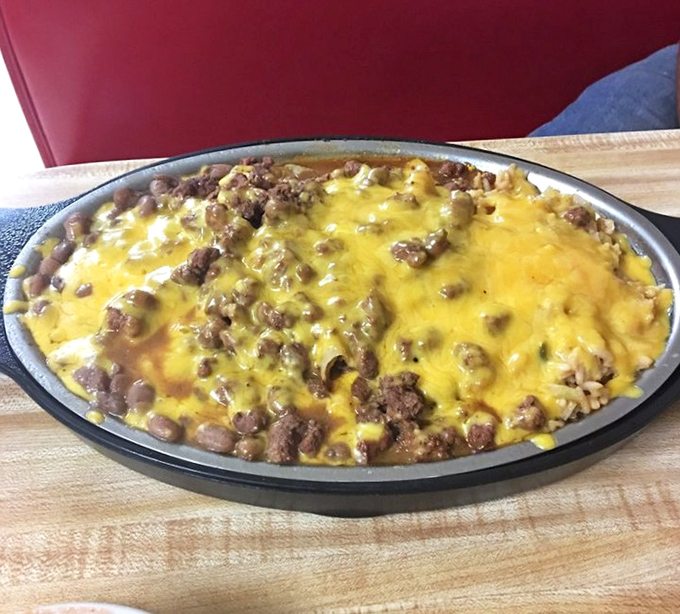 This isn't just cheese and beef having a party &ndash; it's a full-blown Texas fiesta on a plate that's worth every napkin you'll need.