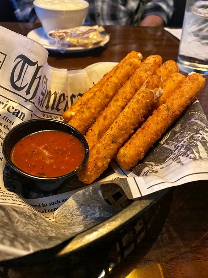 These golden mozzarella sticks aren't just appetizers, they're time machines back to when pulling that first perfect cheese pull felt like winning the lottery.