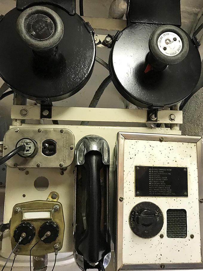 Naval communication equipment that once transmitted vital wartime messages now sits silent, a technological time capsule from a pre-digital age.