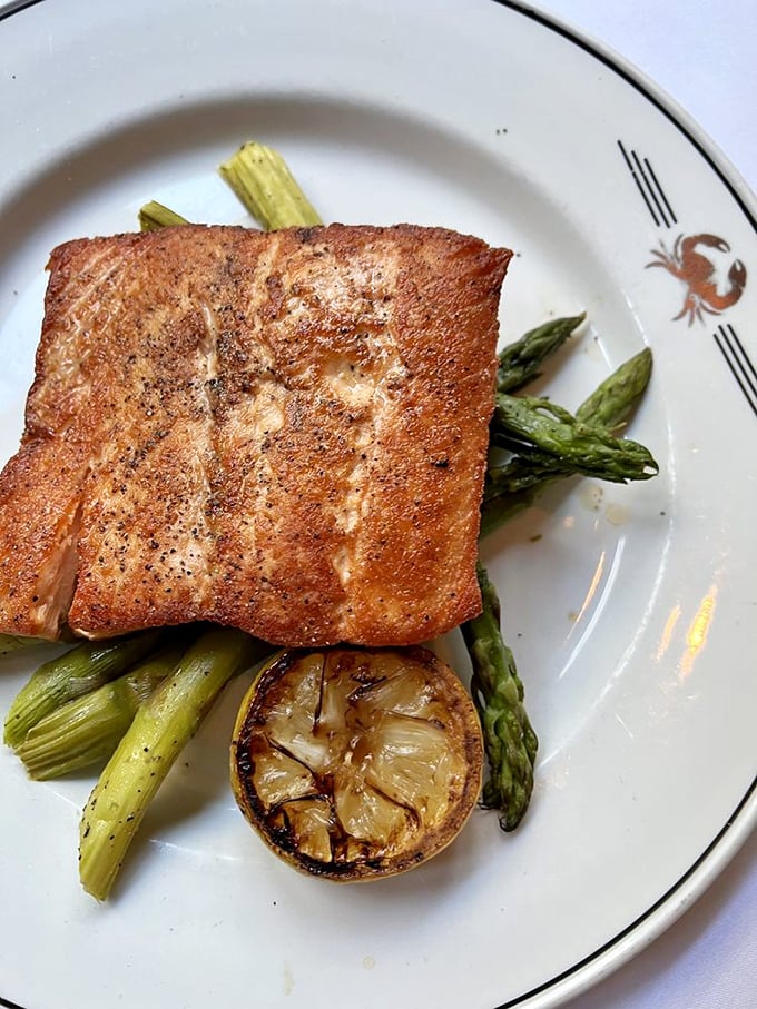Salmon with skin crisped to such perfection it deserves its own spotlight and a standing ovation from asparagus backup dancers.