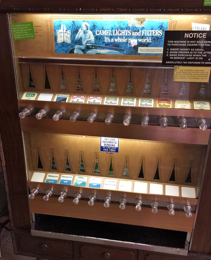 A vintage cigarette machine stands as a museum piece from another era, when diners were smoky havens of conversation and coffee.