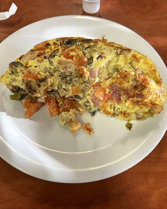This hearty omelet, packed with vegetables and ham, represents breakfast democracy &ndash; where ingredients from all food groups come together in eggy harmony.