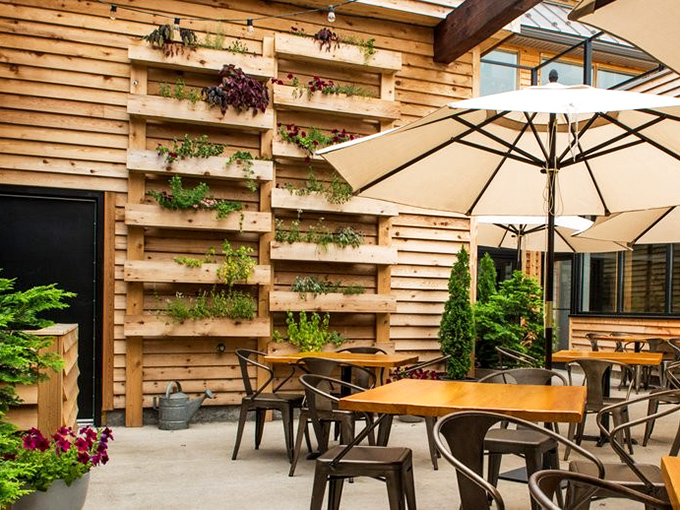 Garden-to-table takes on new meaning with this living wall patio. Nature and nurture combine for the perfect outdoor dining sanctuary.