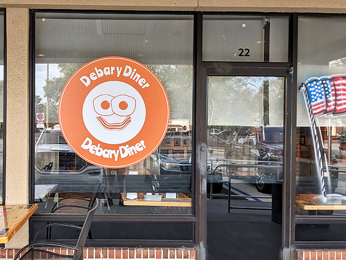 Outdoor Seat: The cheerful orange logo with its smiling face says everything about this place&mdash;unpretentious, welcoming, and just happy you decided to stop by.