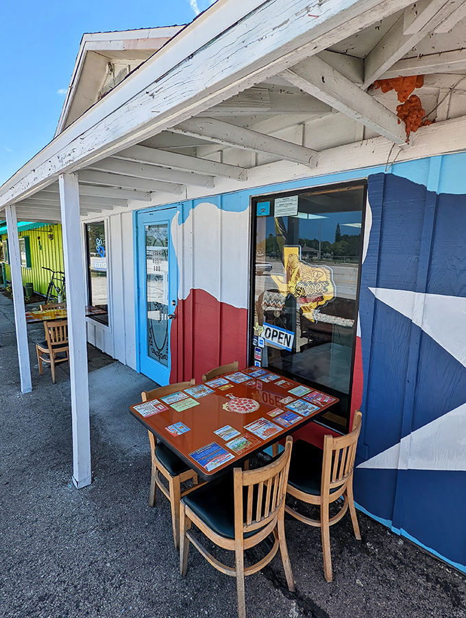 Al fresco Texas style! The outdoor seating area painted with the Texas flag offers a perfect spot for enjoying barbecue in Florida sunshine.