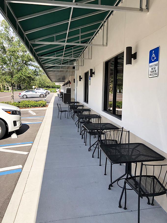 Al fresco dining, Florida-style. These outdoor tables offer the perfect perch for people-watching while contemplating the deeper meanings of proper sandwich construction.