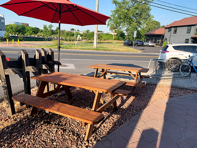 Al fresco dining with a red umbrella—because pastries taste 37% better with a gentle breeze and vitamin D.