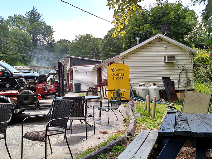 The outdoor area where smoke signals announce to the neighborhood: "Yes, we're cooking today." Those chairs have heard countless post-meal sighs of contentment.