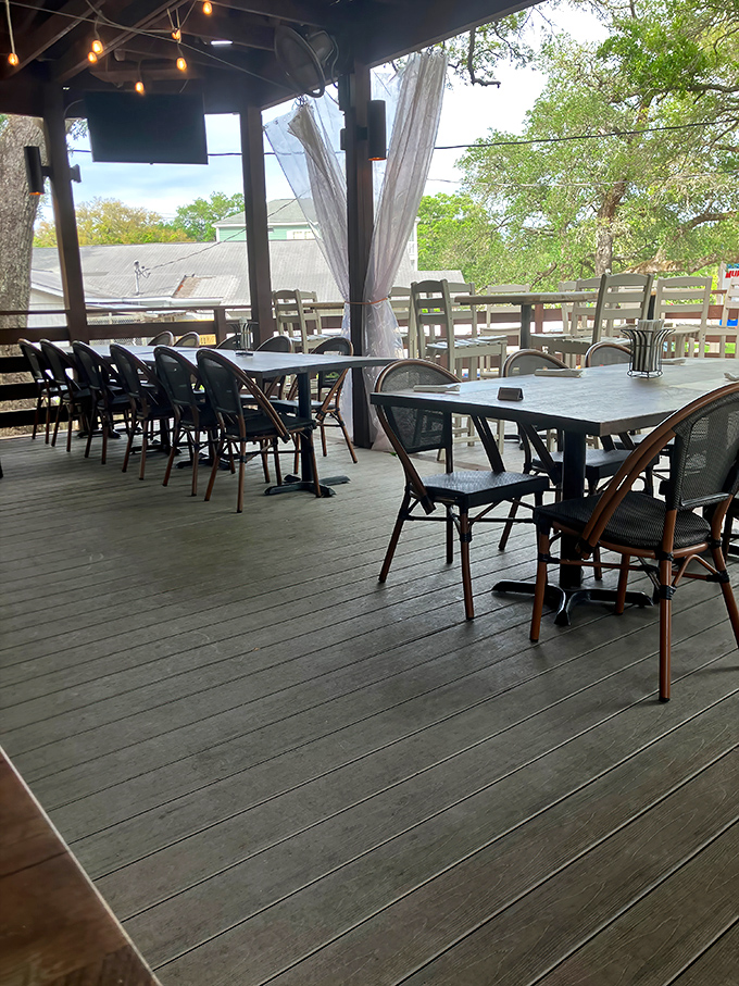 The covered deck where ocean breezes enhance every bite. Mother Nature: still the world's best restaurant ambiance designer.