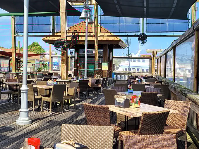 Rusty's outdoor seating area &ndash; where the gentle harbor breeze serves as nature's air conditioning and boats provide the entertainment.