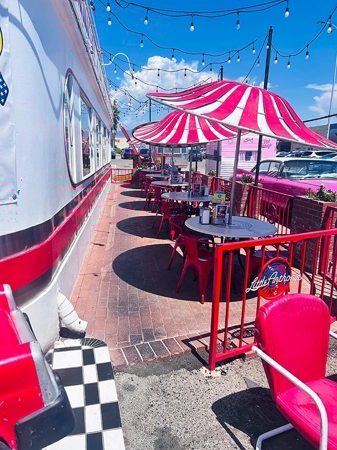 Outdoor dining under carnival-style umbrellas adds a touch of whimsy. String lights overhead promise magic as the desert sun sets.