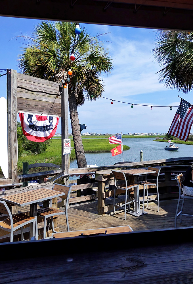 Outdoor dining with a side of patriotism and palm trees. The salt marsh breeze here is nature's perfect seasoning.