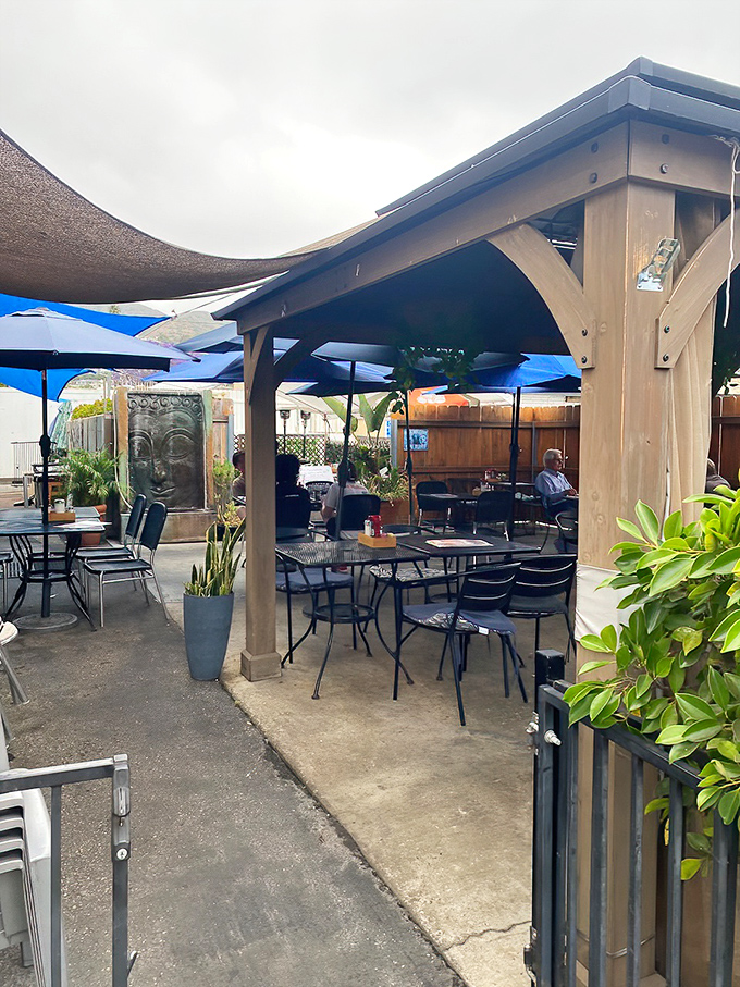Outdoor seating with California casual vibes. Where breakfast meets fresh air under the gentle protection of umbrellas and wooden beams.