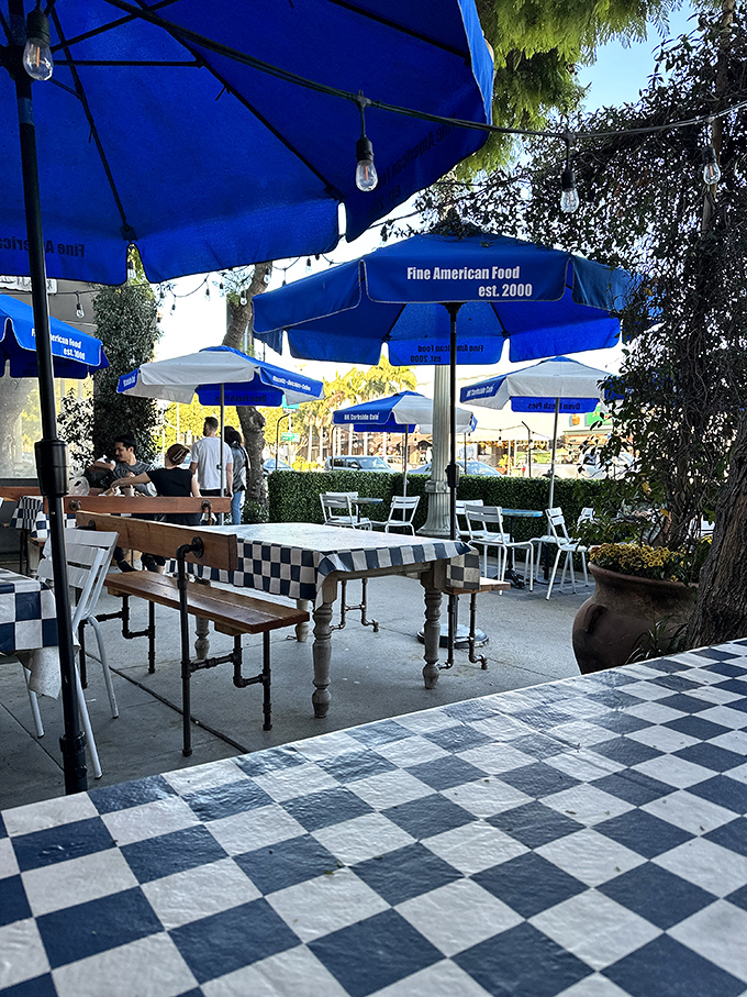 Al fresco dining under blue umbrellas, where the only thing better than the weather is what's on your plate.