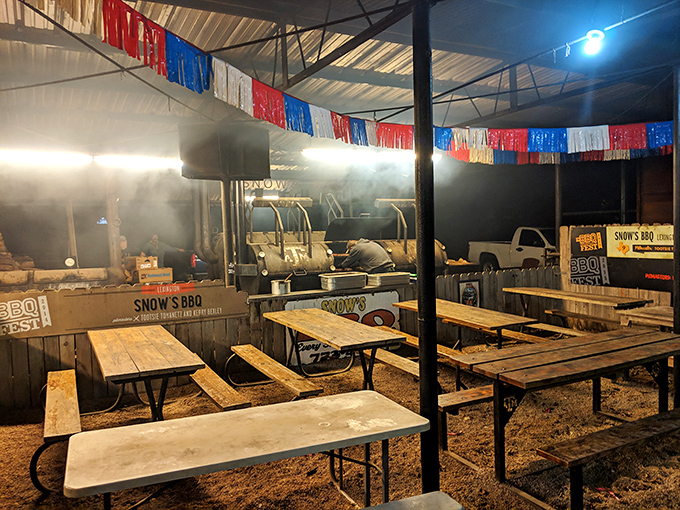 As night falls, the smoking continues under strings of lights—meat doesn't care what time it is, and neither do true barbecue devotees.