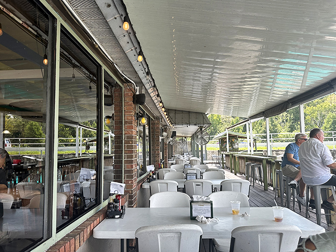 Outdoor seating that lets the lake breeze season your meal. Nature's air conditioning comes standard with every waterfront table.