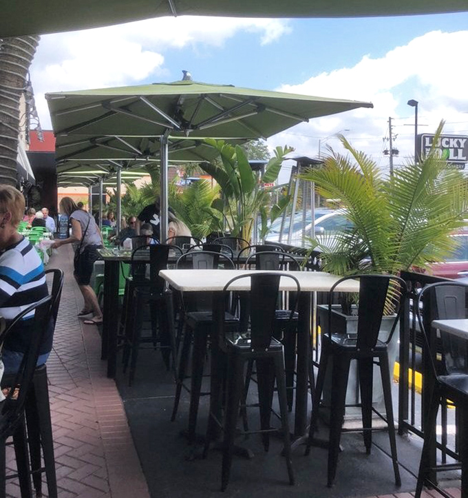 Florida sunshine meets New York flavor on this outdoor patio. Palm trees and pastrami&mdash;a combination that somehow makes perfect sense.